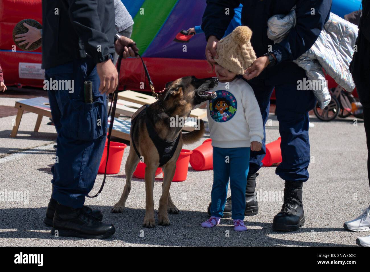 A child pets a Coast Guard K9 during Sector Houston-Galveston’s ...