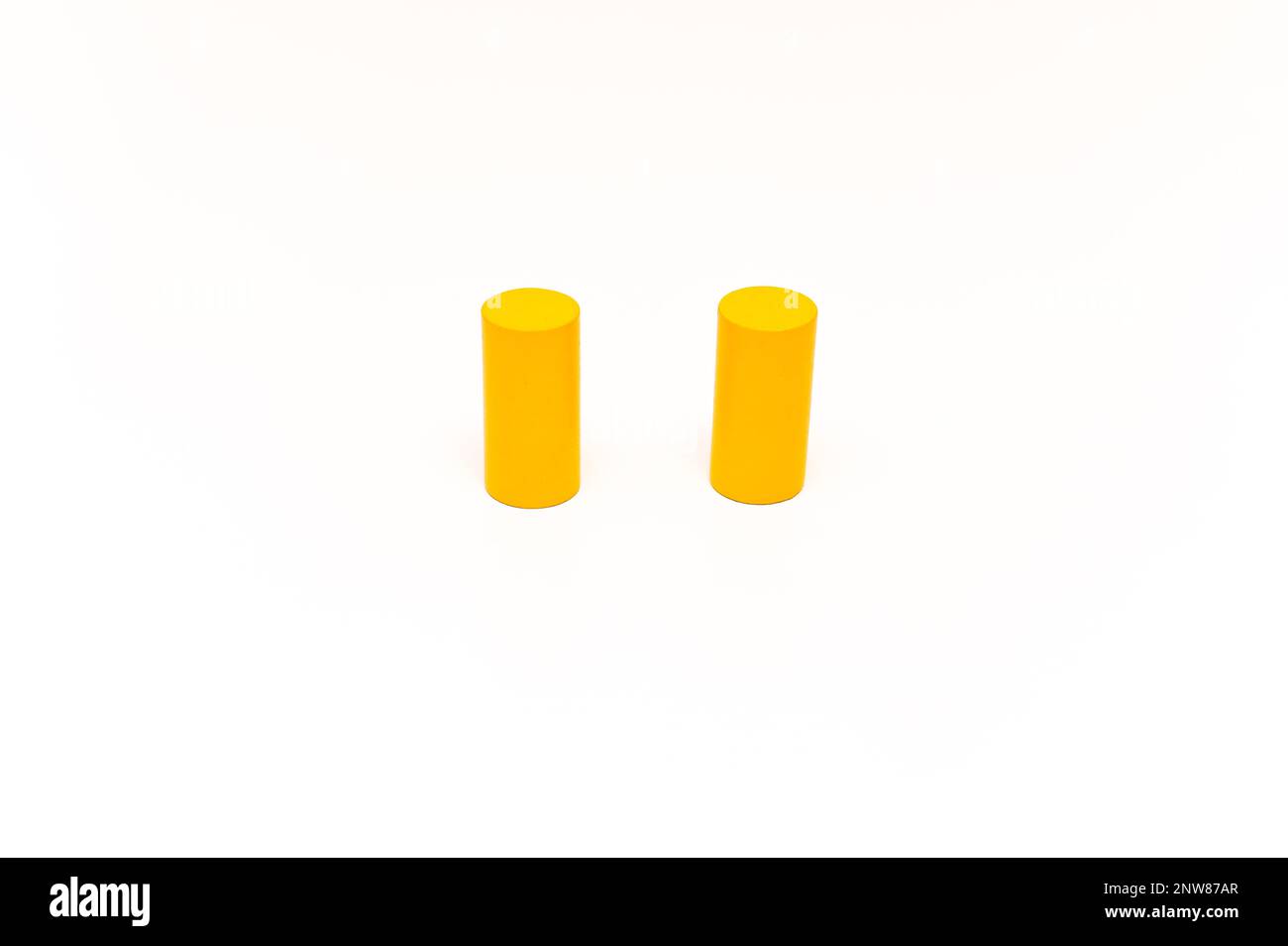 Two identical cylinders on a white background. concept. mock up Stock ...