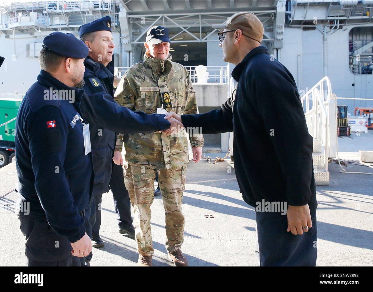 USS Gerald R. Ford (CVN 78) Command Master Chief Bryan Davis, right ...
