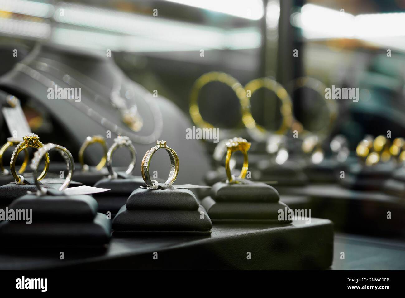 Jewelry diamond rings and necklaces show in luxury retail store window ...