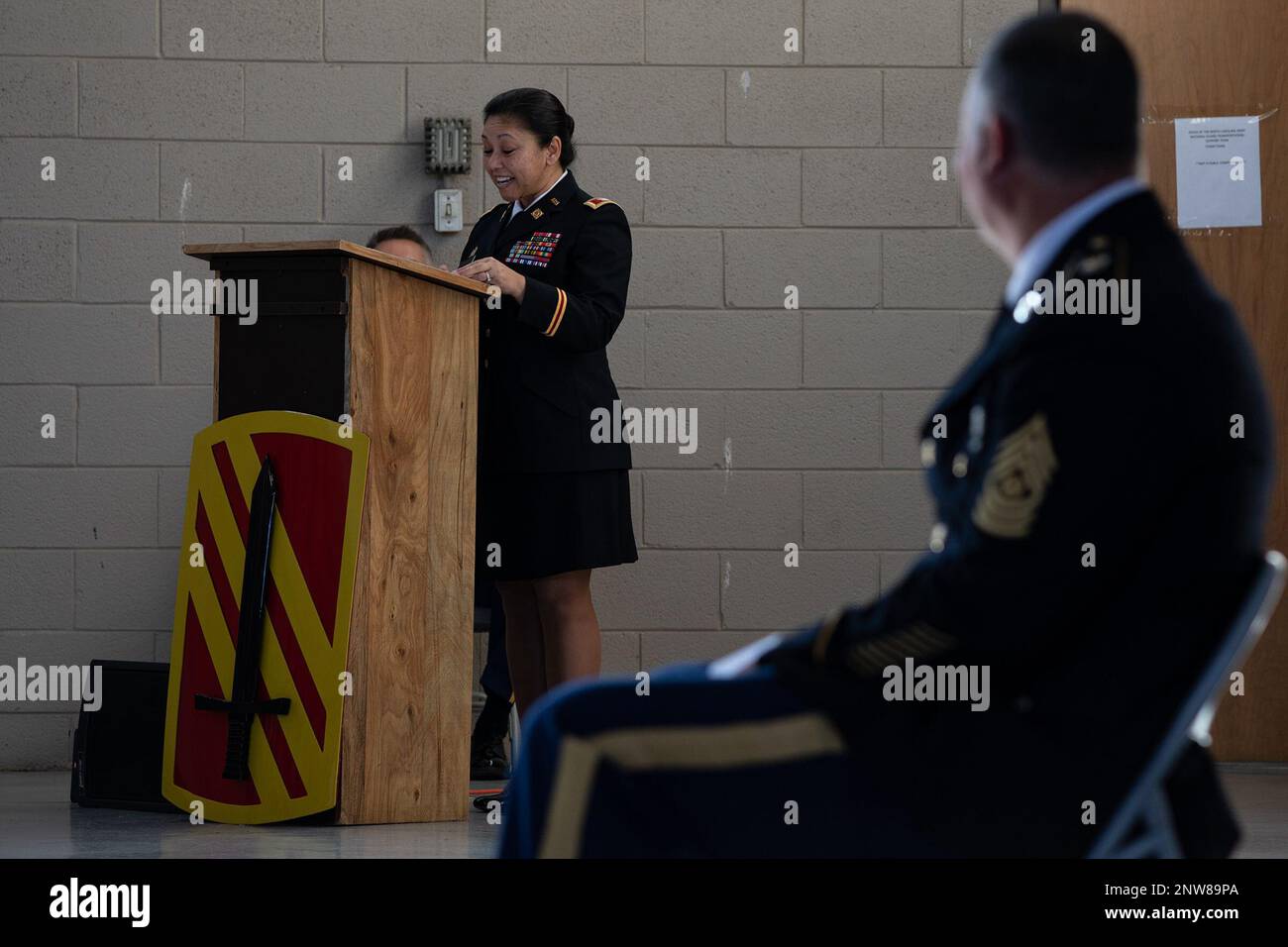 Command Sgt. Maj. Randy Ly, right, completes his last official duty for ...