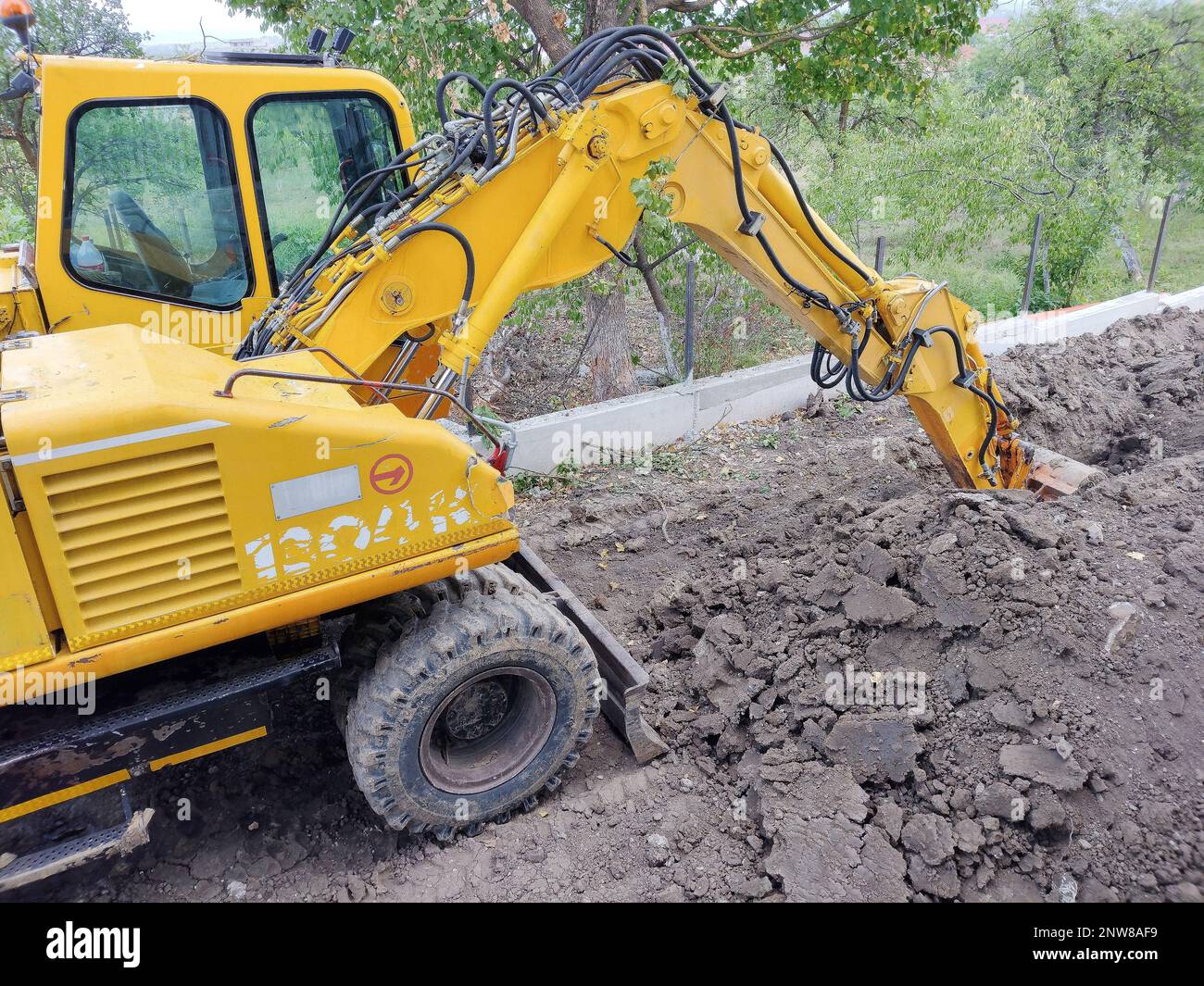 an excavator is stationed in an area where work is taking place Stock ...
