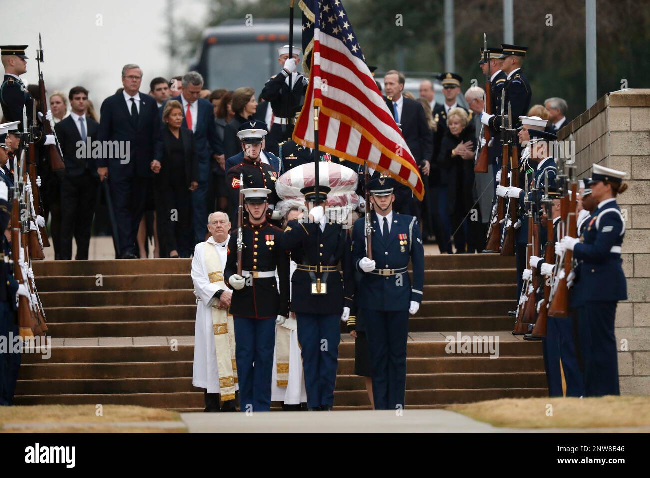 The flag-draped casket of former President George H.W. Bush is carried ...