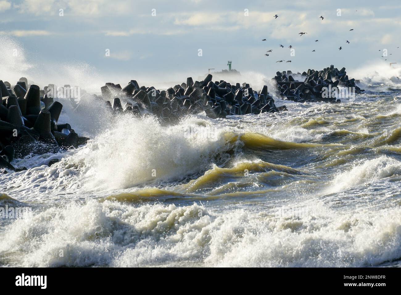 Coastal storm in the Baltic Sea, big waves crash against the concrete ...