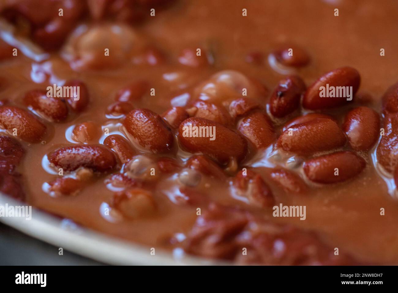 Brown brazilians beans being cooked showing details of the grains and ...