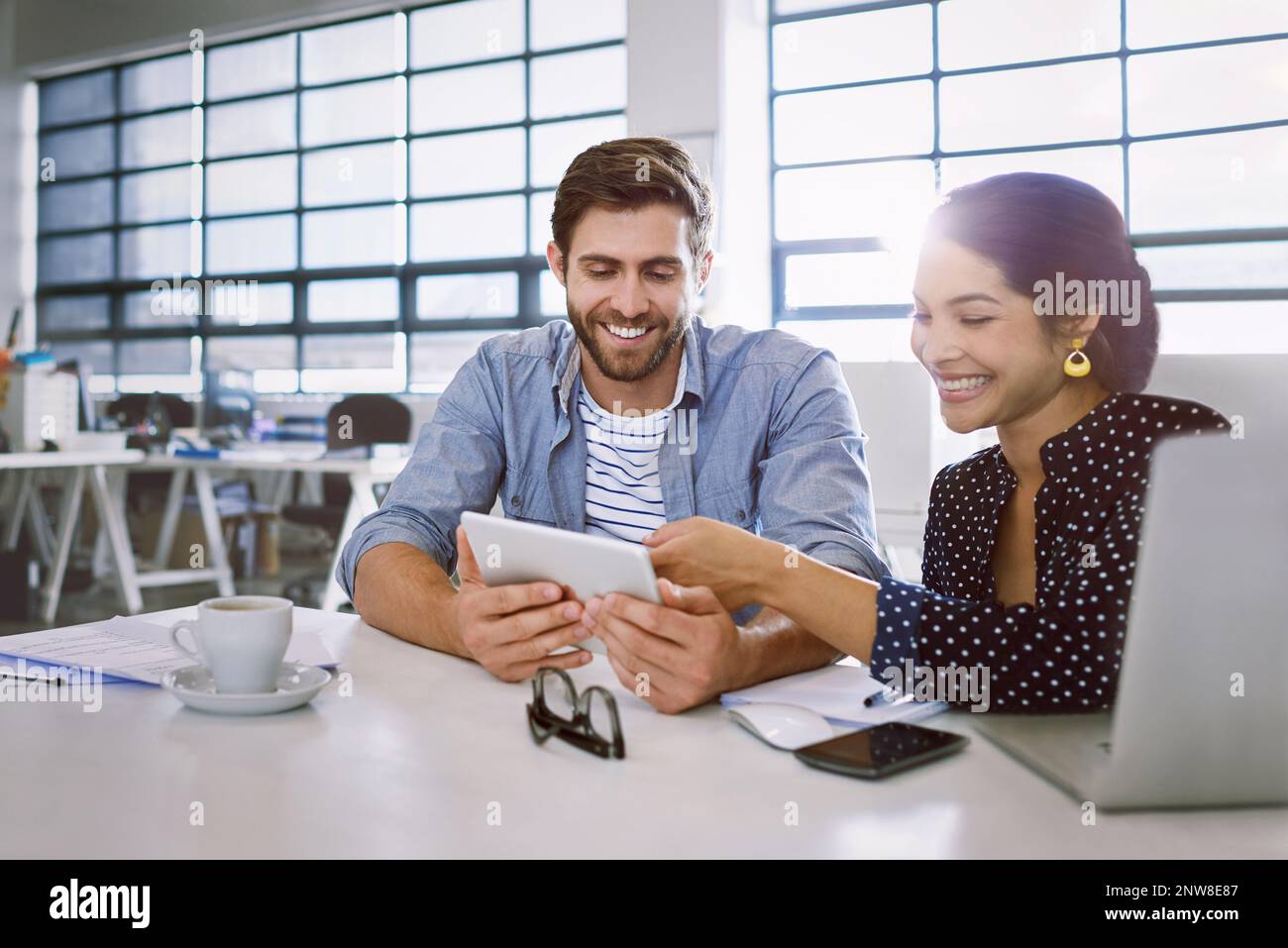 Collaboration, tablet and man with woman in reading email in creative ...