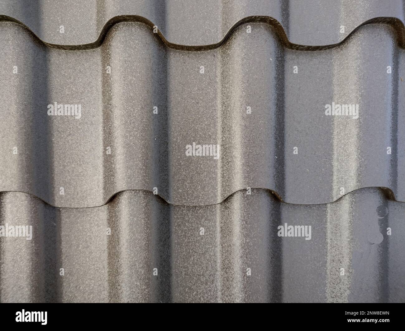 Metal tile for the roof of buildings Stock Photo - Alamy