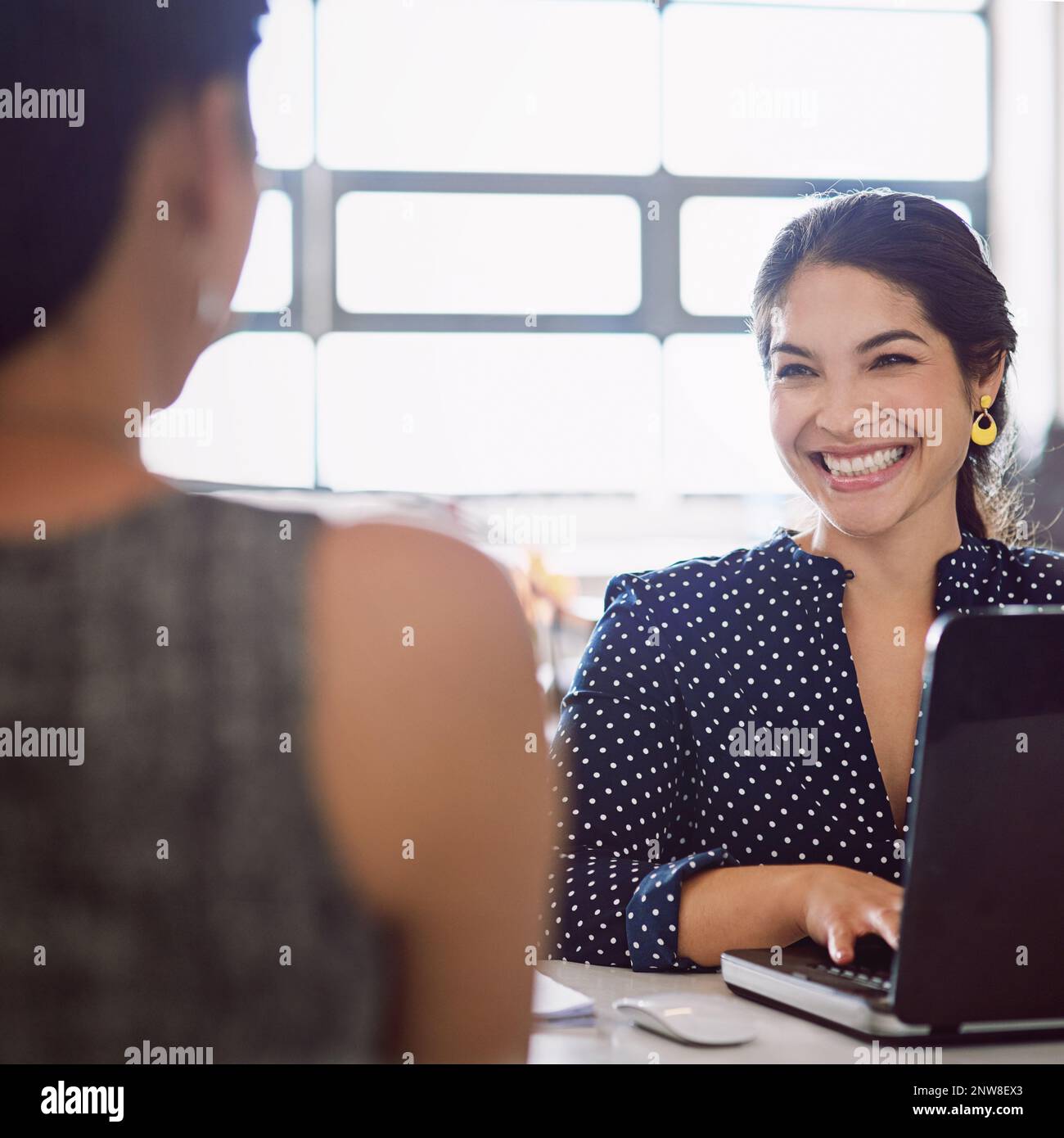 Coworking, happy and business women talking for a meeting, interview or ...