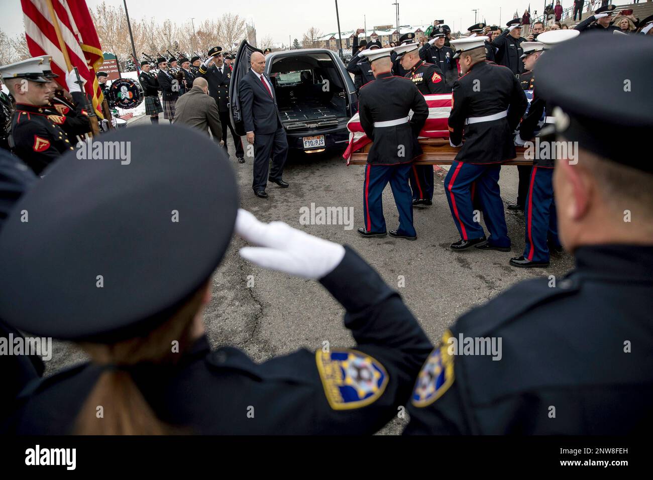 The casket of South Salt Lake police officer David Romrell is loaded ...