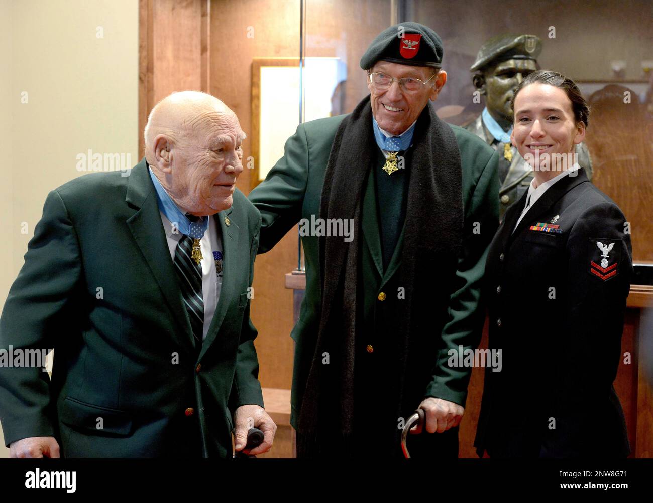 Retired Army Col. Roger H.C. Donlon, center, poses for a photo with his ...