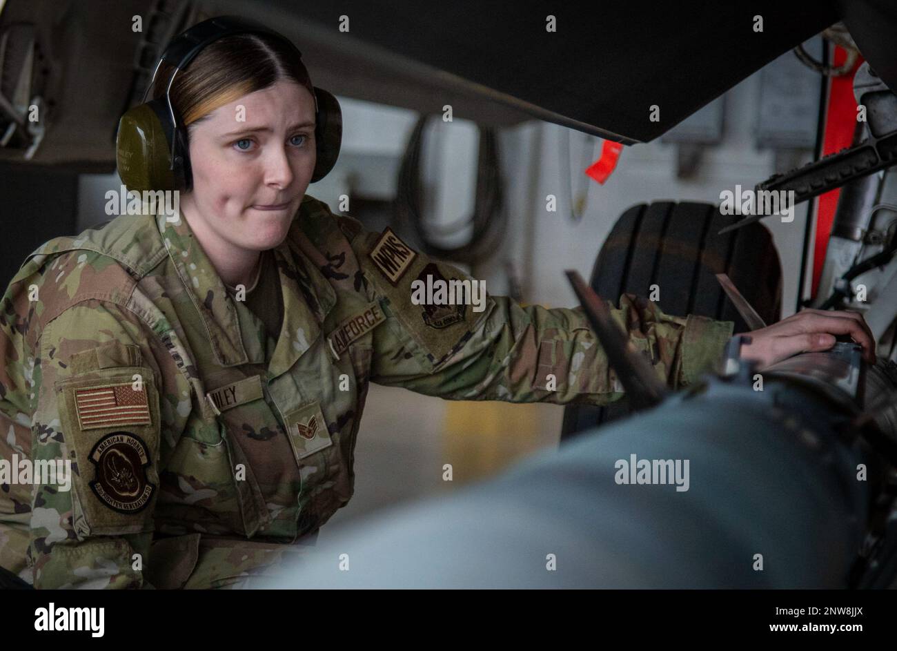 Staff Sgt. Kayla Smiley, 43rd Fighter Generation Squadron, directs an ...