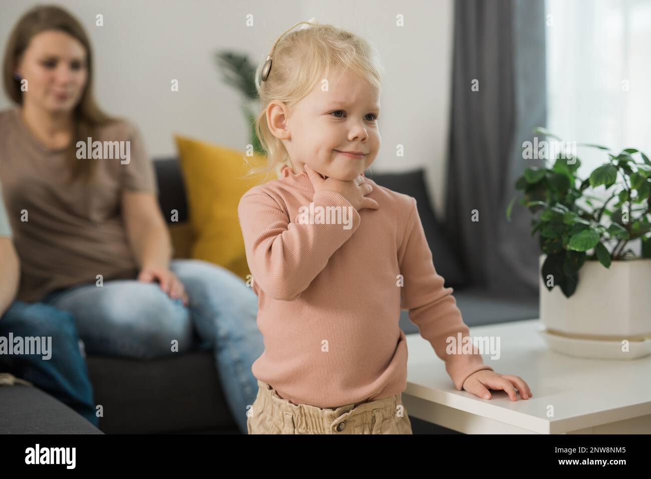 Cochlear implant system. Installation cochlear implant on child girl ...