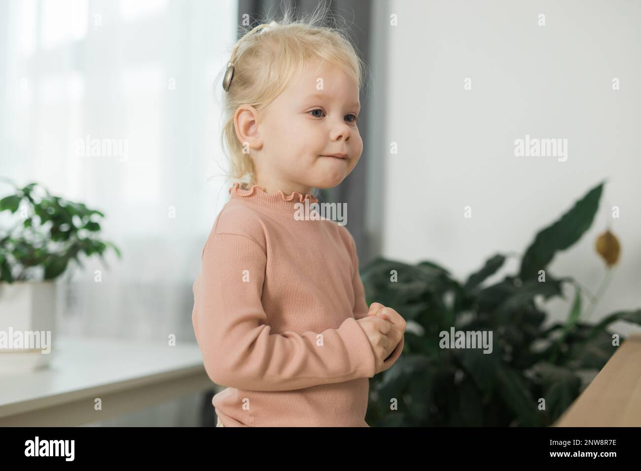 Cochlear implant system. Installation cochlear implant on child girl ...