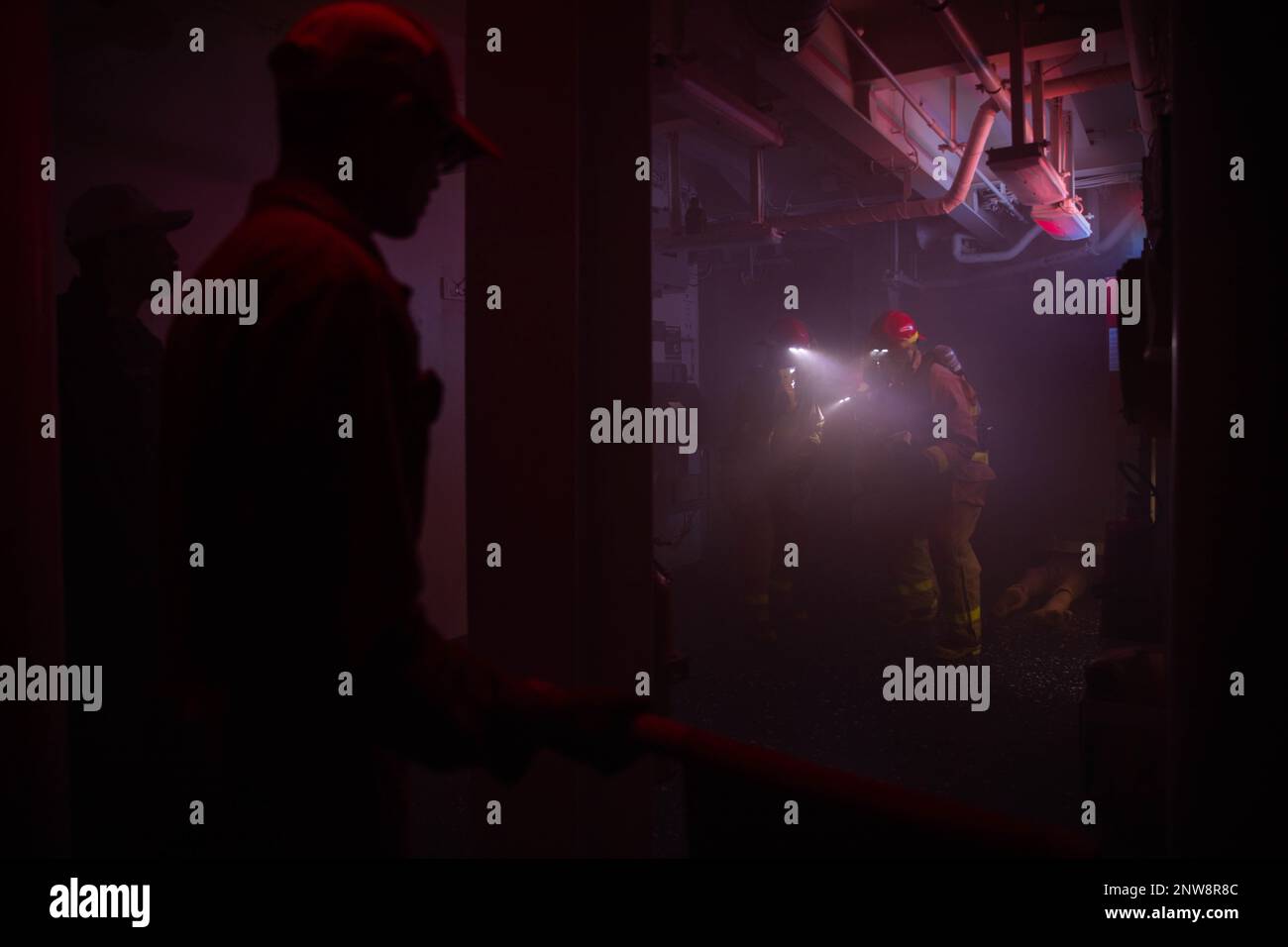 230119-N-EI127-1216 Sailors fight a simulated fire aboard amphibious ...