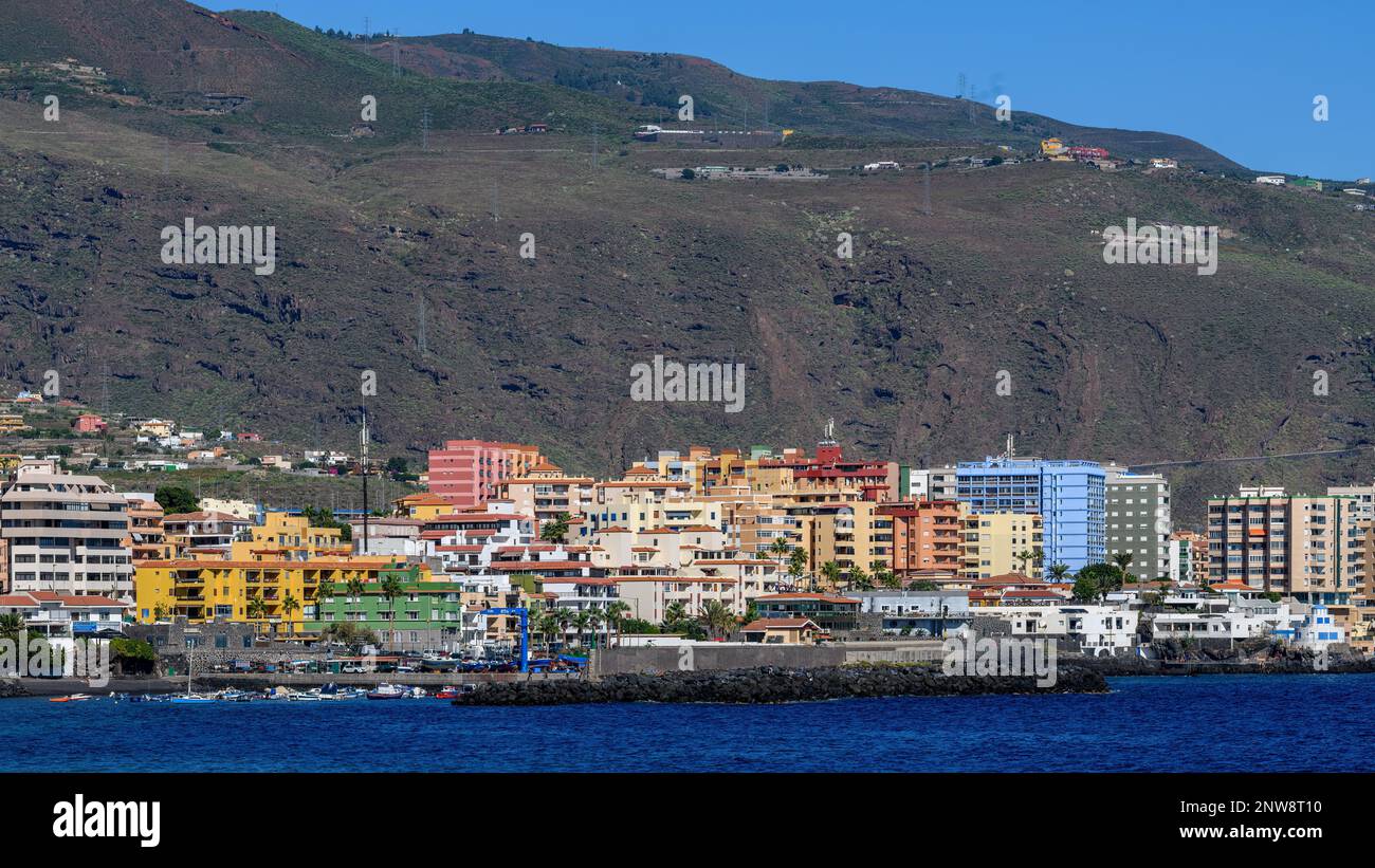 Colourful buildings line the Atlantic shore of Candelaria in Tenerife ...