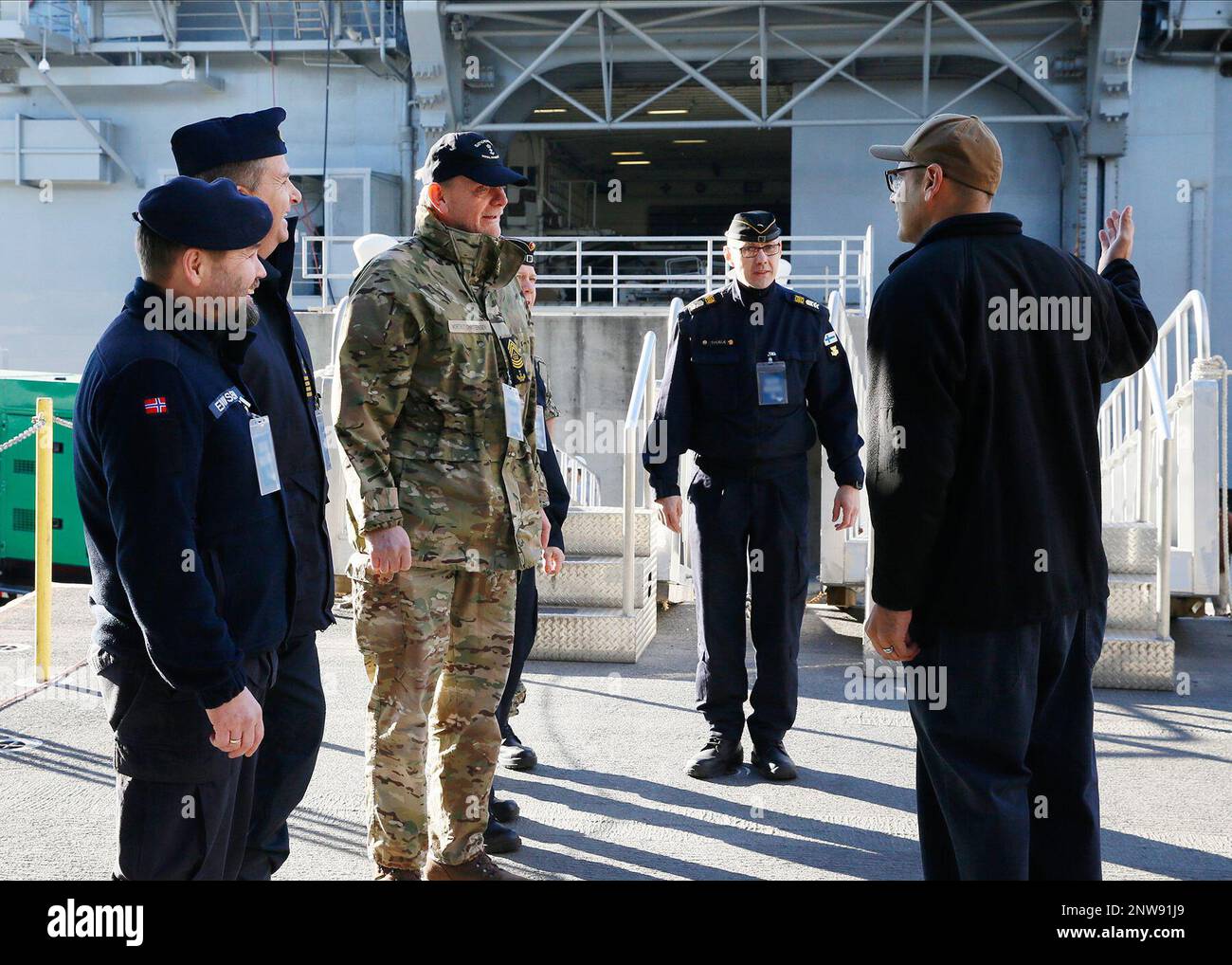 USS Gerald R. Ford (CVN 78) Command Master Chief Bryan Davis, right ...