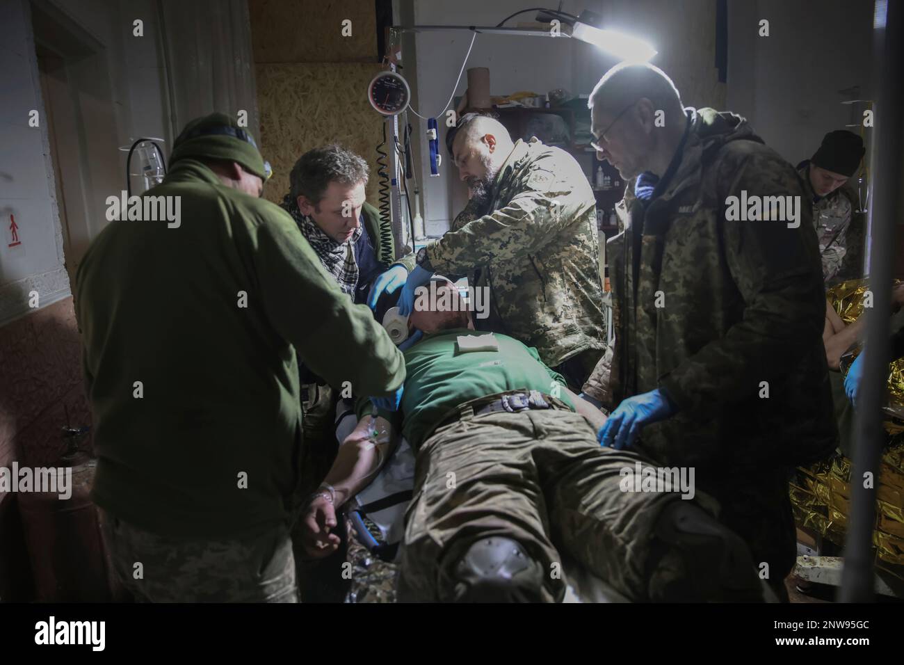 Medics give the first aid to a wounded Ukrainian soldier near Bakhmut ...