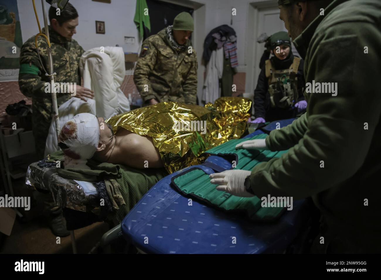 Medics give the first aid to a wounded Ukrainian soldier near Bakhmut ...