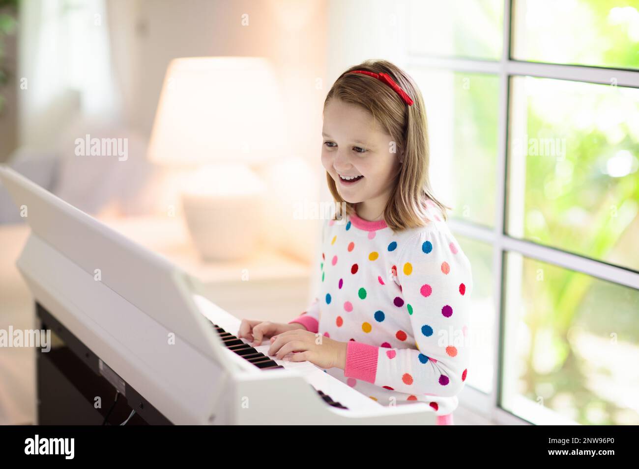 Child playing piano. Kids play music. Classical education for children ...