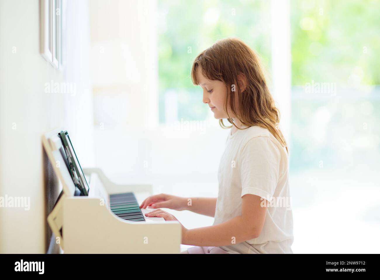 Child playing piano. Kids play music. Classical education for children ...