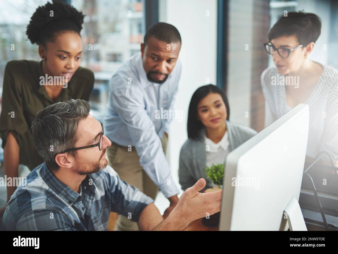 Working together to get the task done. Shot of businesspeople working ...