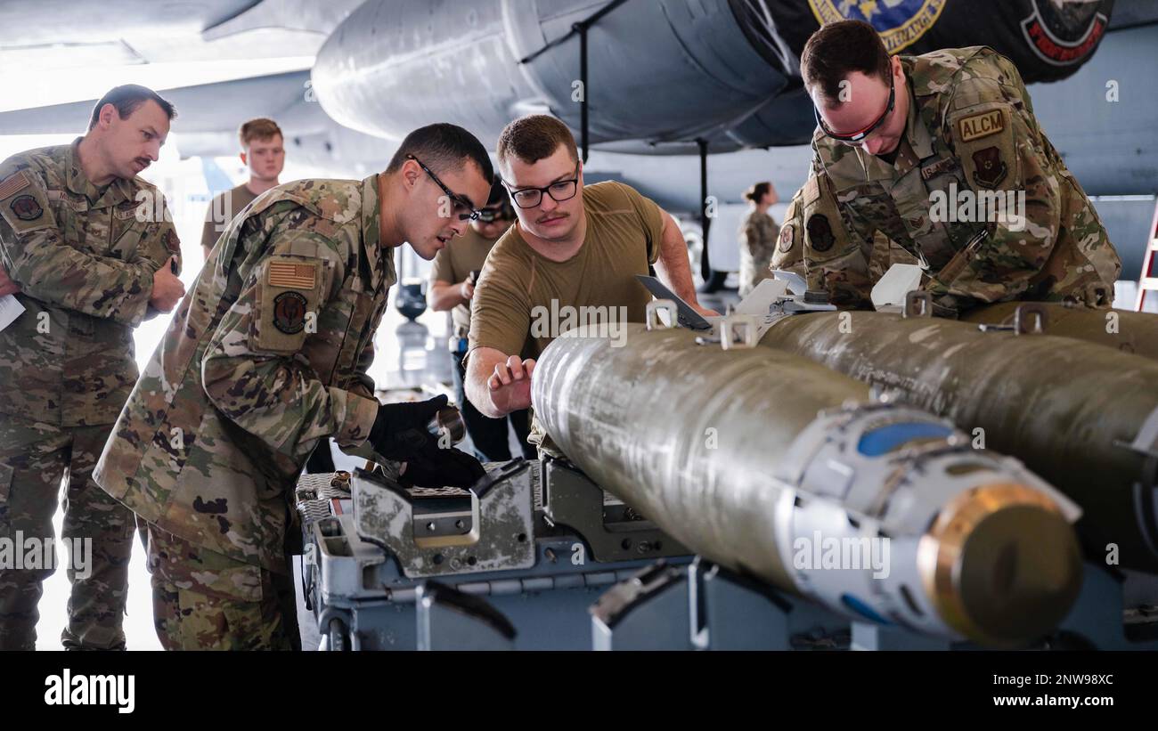 Airmen from the 2nd Munitions Squadron assemble an inert munition during a weapons load ...