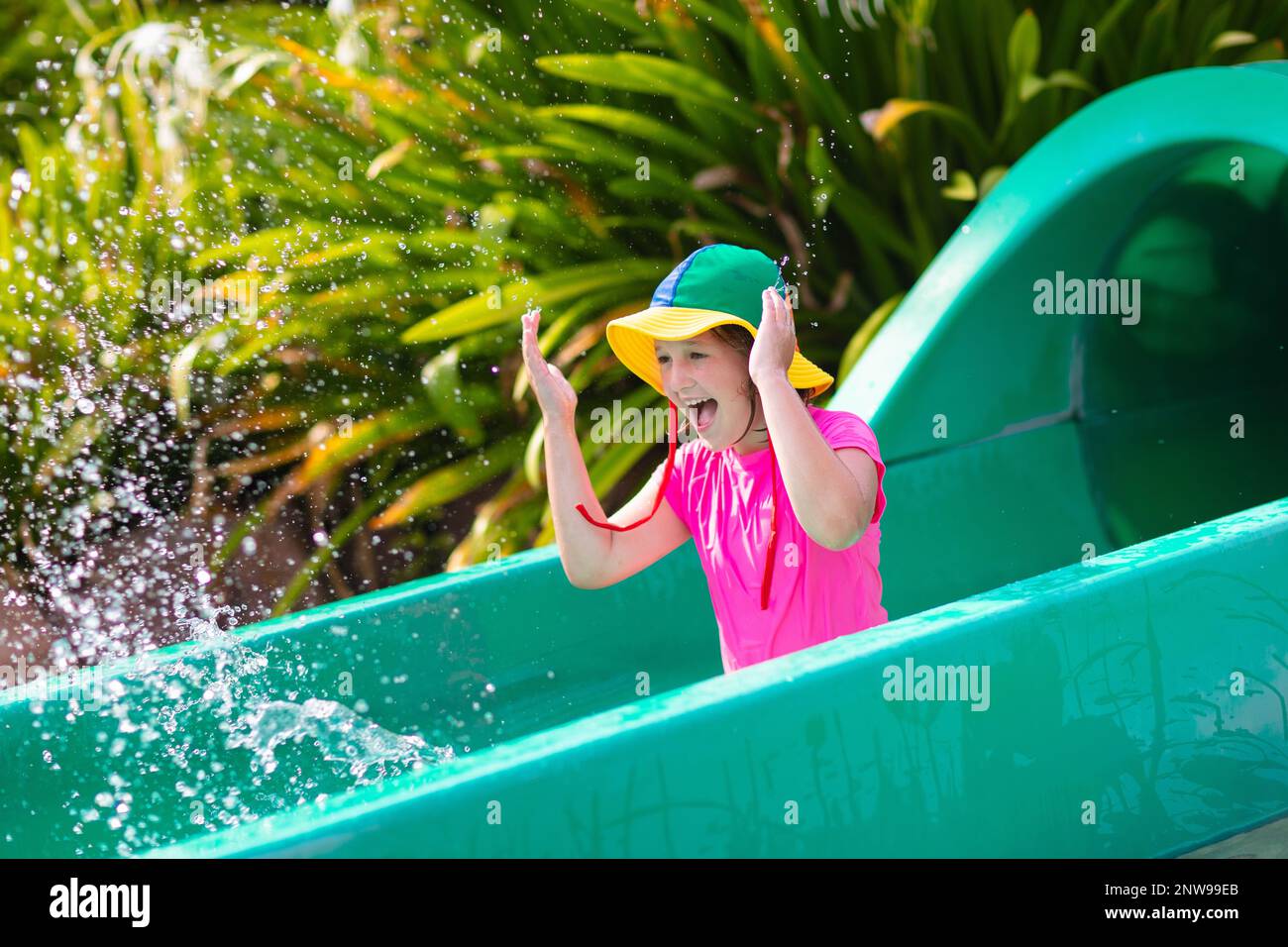 Girl slide slides splash hi-res stock photography and images - Alamy