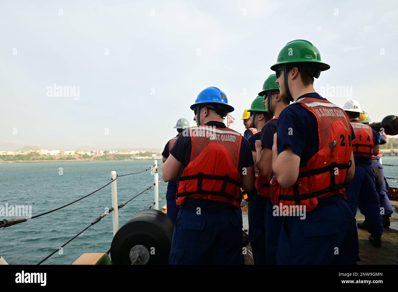 Crew members assigned to USCGC Spencer (WMEC 905), watch the Praia ...