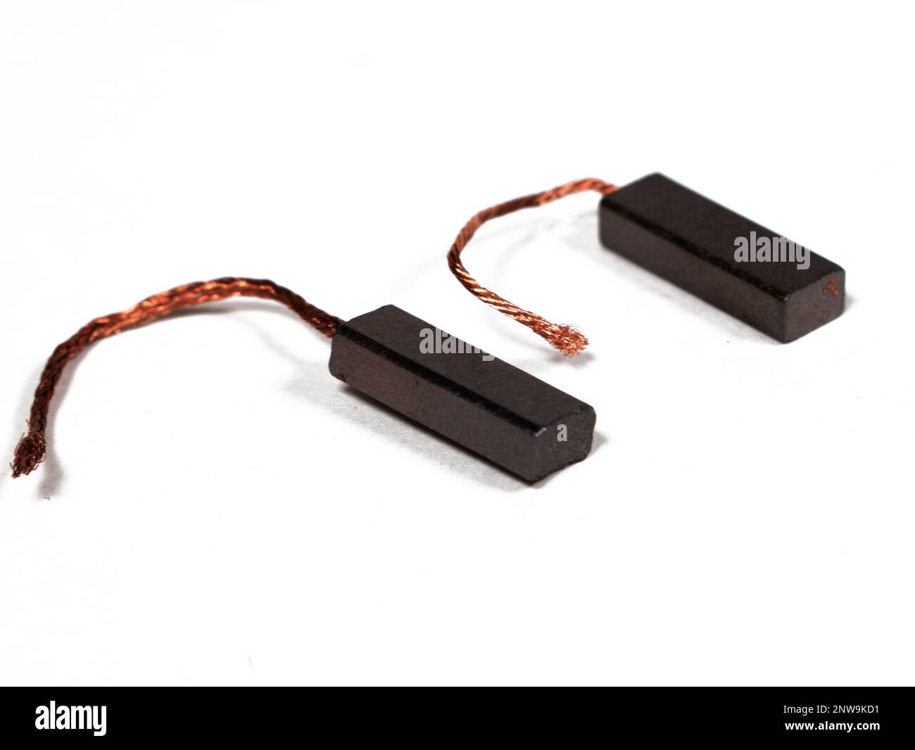 Graphite brushes of a car alternator isolated on white background ...