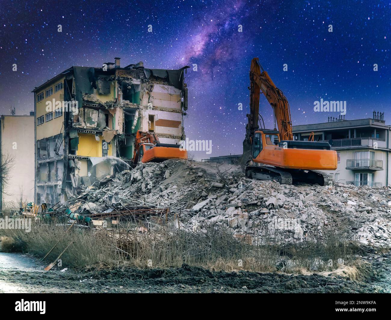 Demolition in Progress. Yellow Excavator Tears Down Concrete Beams and ...