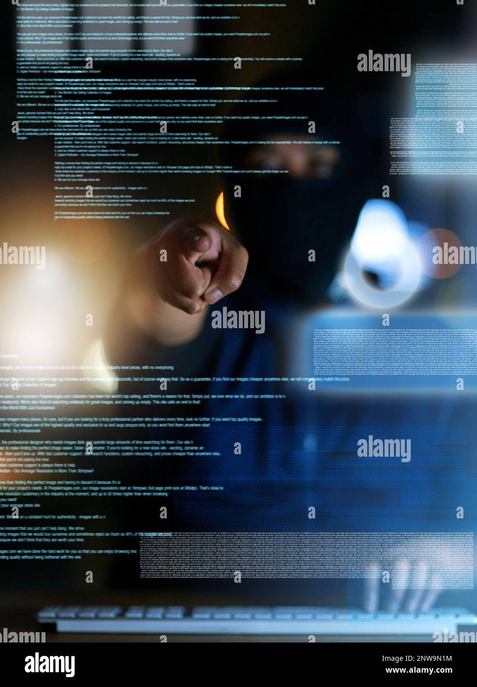 Youve been hacked. Shot of a hacker cracking a computer code in the dark Stock Photo - Alamy