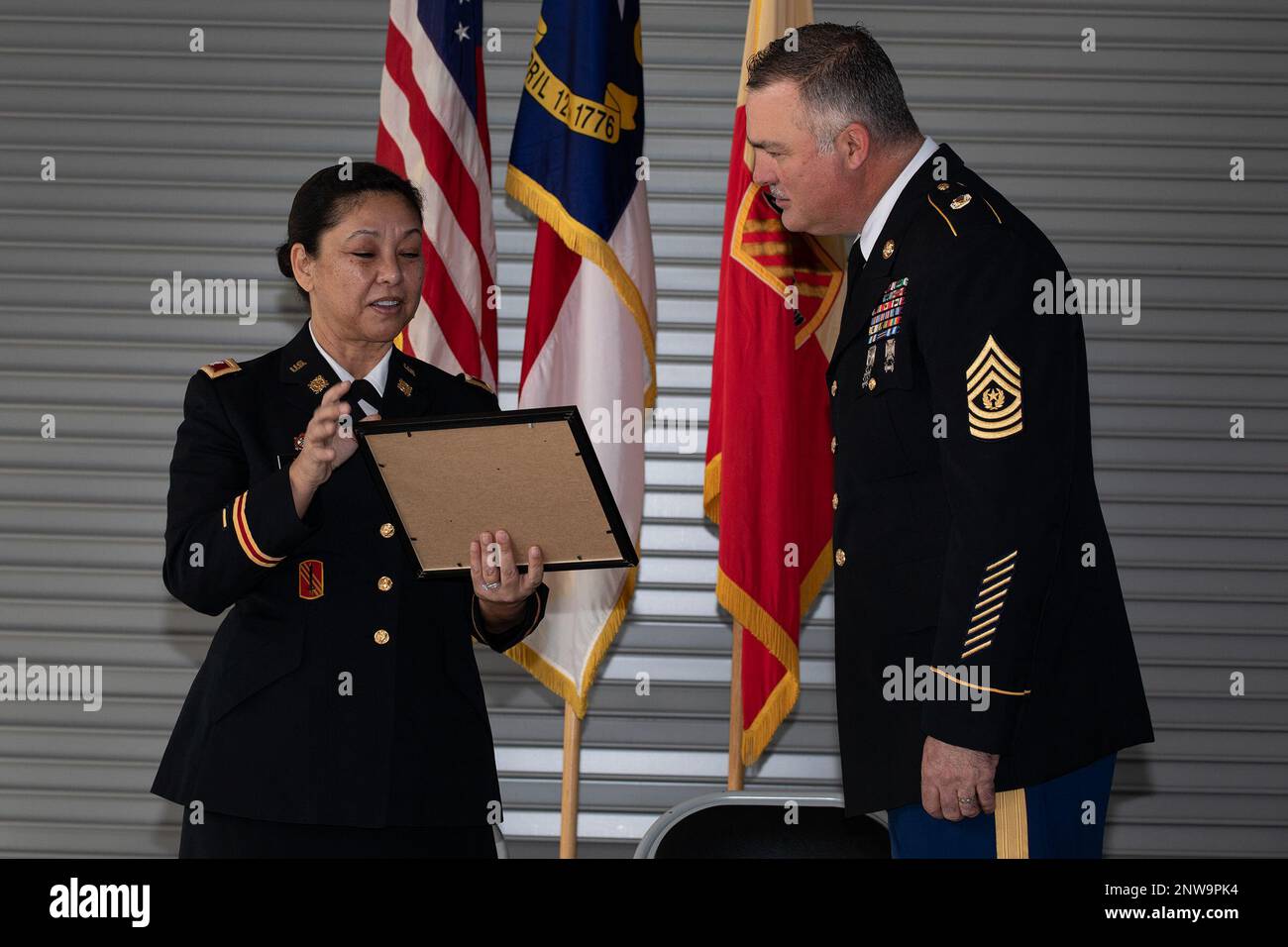 Command Sgt. Maj. Randy Ly, right, completes his last official duty for ...