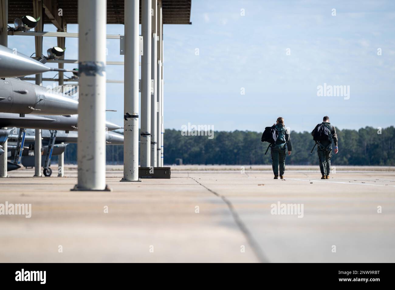 U.S. Air Force 55th Fighter Squadron pilots approach their aircraft at ...