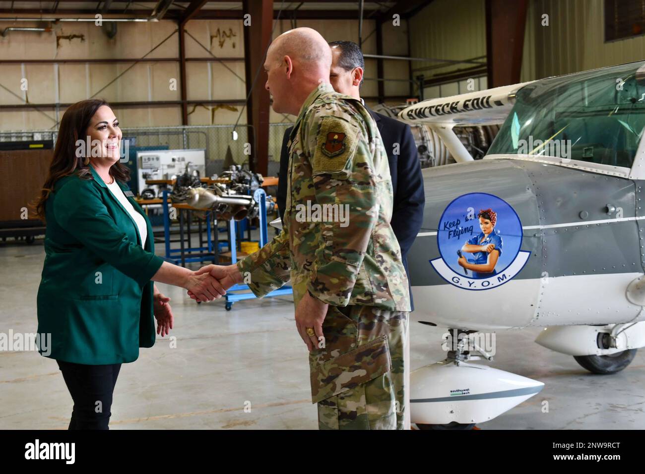 Col. Blaine Baker, 97th Air Mobility Wing commander coins Jill Lazenby ...