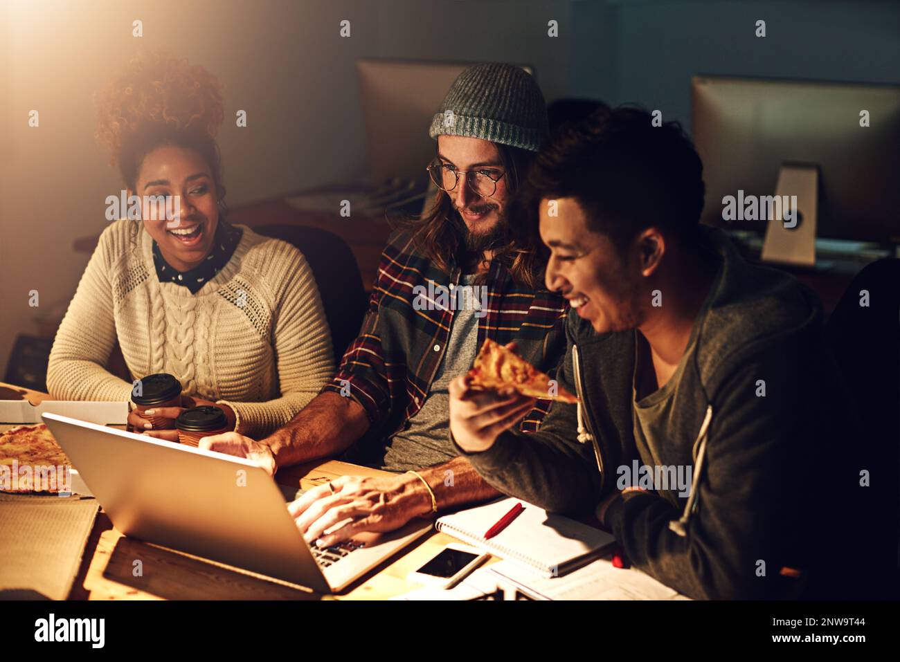 Laptop, happy collaboration and night team programming ERP software, cyber security system or ...