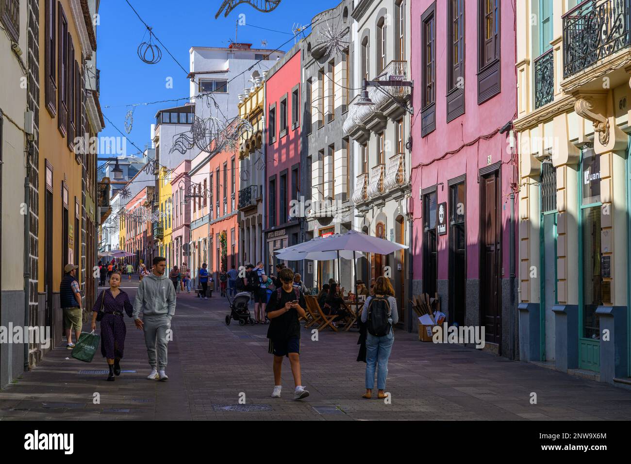 Afternoon winter sunshine lights up the multi-coloured buildings that ...