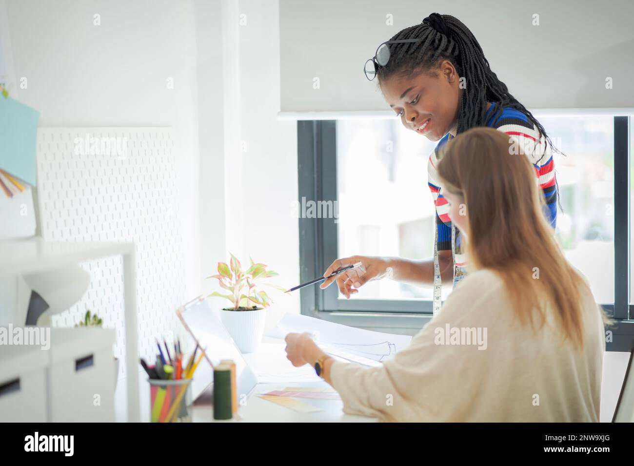 Women working together Small business, SME, tailoring designs for ...