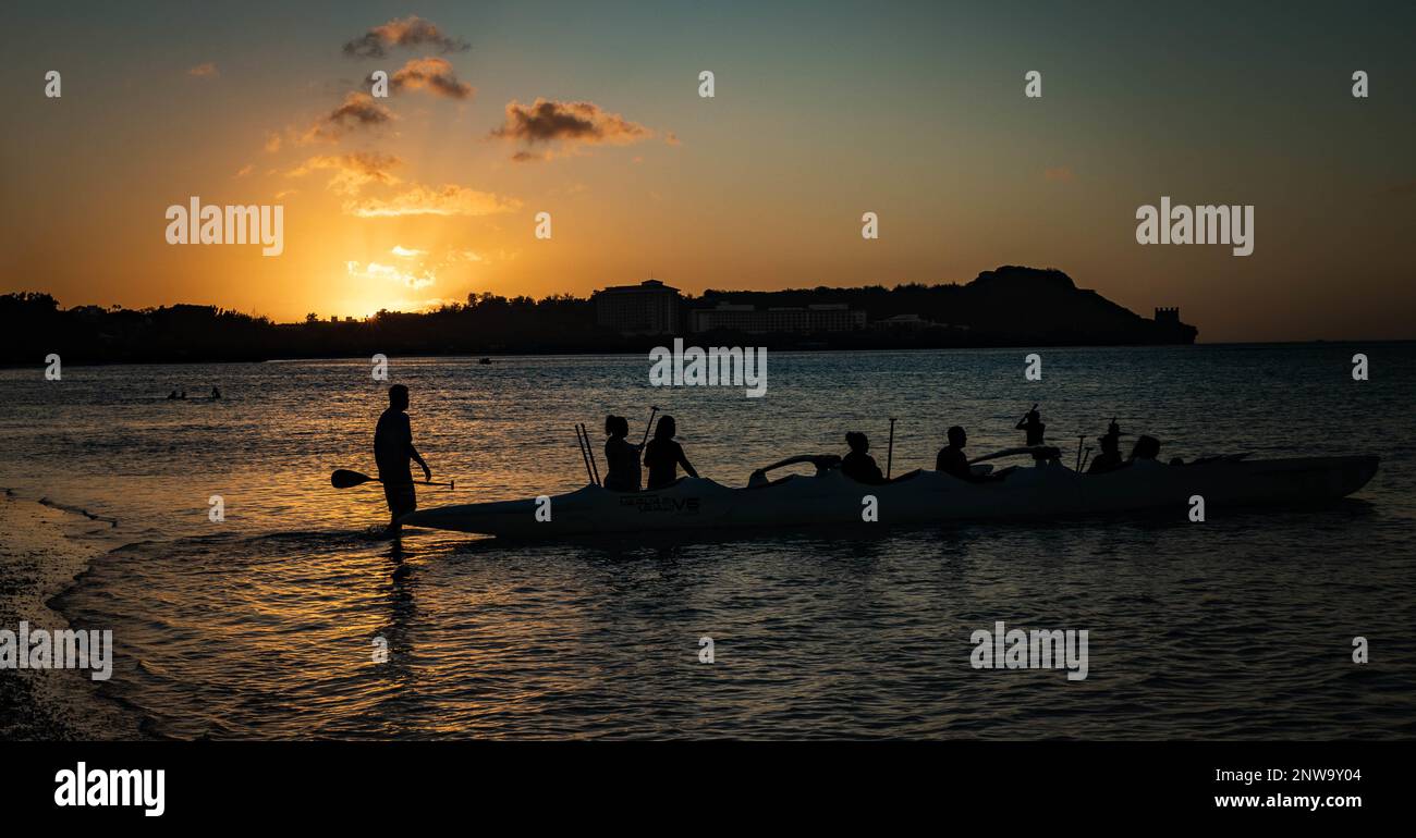 Local residents of Guam swim and view the Pacific Ocean at Matapang ...
