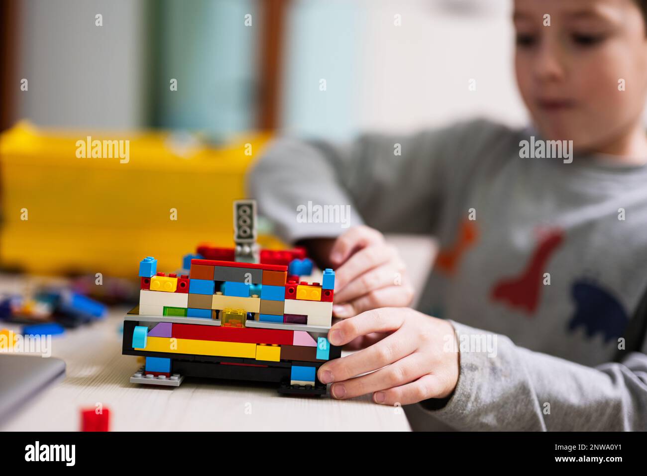 Ternopil, Ukraine - February, 2023: Boy kid constructing toy use Lego ...