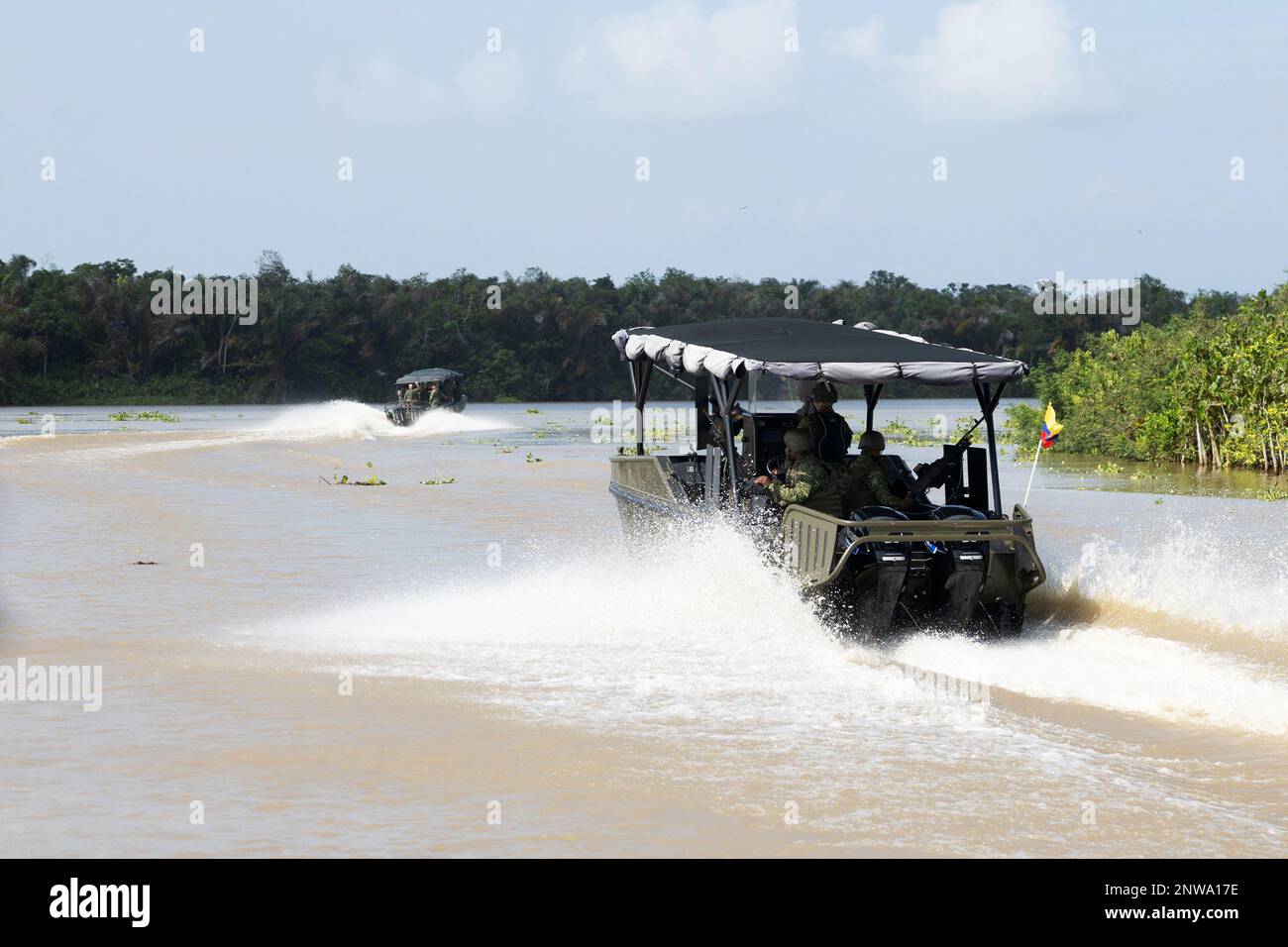 Two Colombian Marine Corps combat riverine boats sail on the Atrato ...