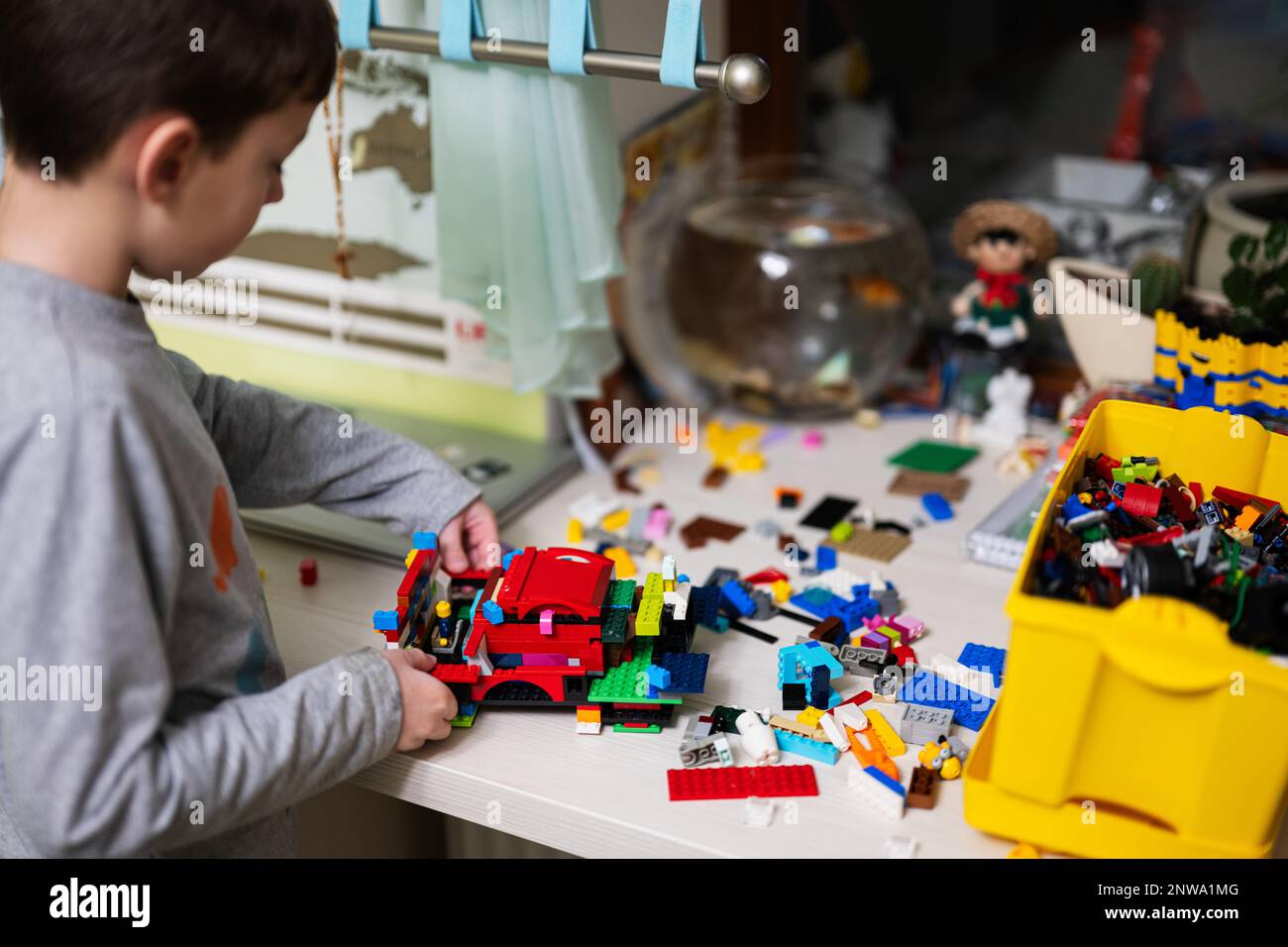 Ternopil, Ukraine - February, 2023: Boy kid constructing toy use Lego ...