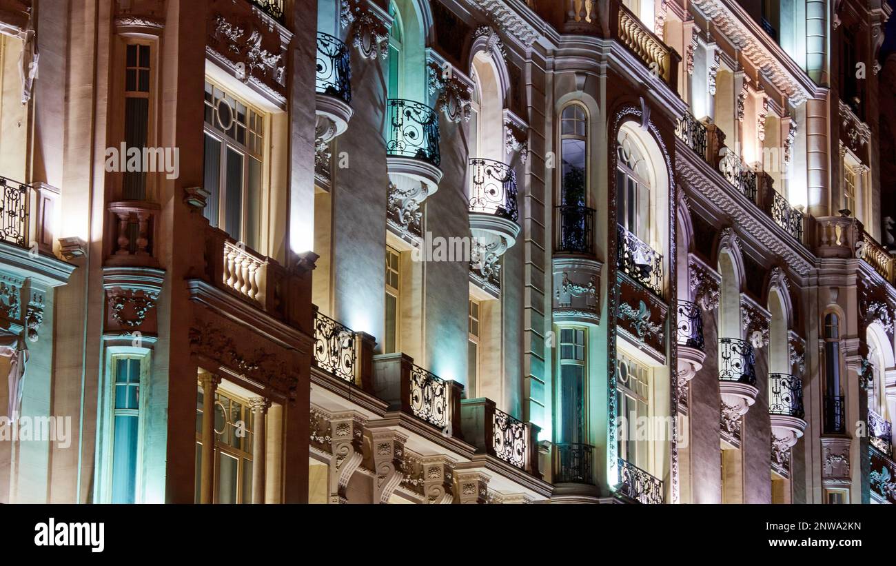 Detail of the facade of a stately building with decorative night ...