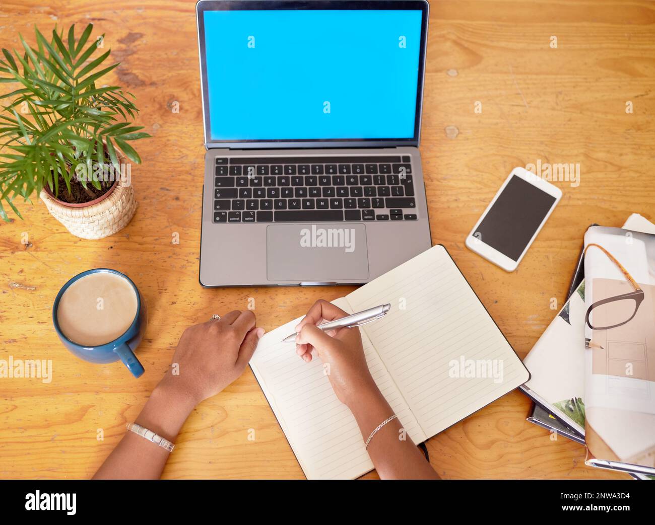 Top view, mockup and laptop with green screen, hands and planning for ...
