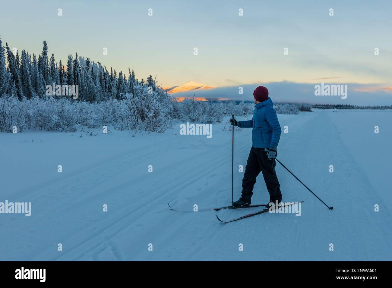 Amazing pastel sunset views along the Yukon River with one person ...