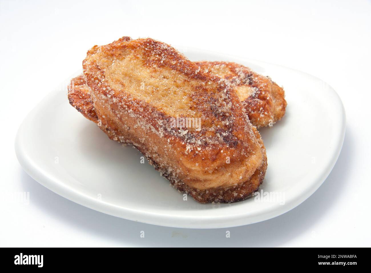 Torrijas. Typical Spanish sweet made of fried bread soaked in milk with ...
