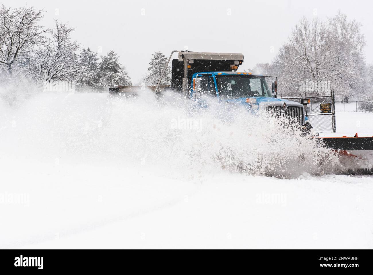 A snowplow operator from the 88th Civil Engineer Squadron clears ...