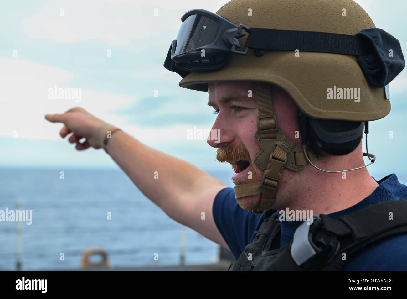 U.S. Coast Guard Petty Officer 2nd Class Jeremiah Johnson, a gunner’s ...