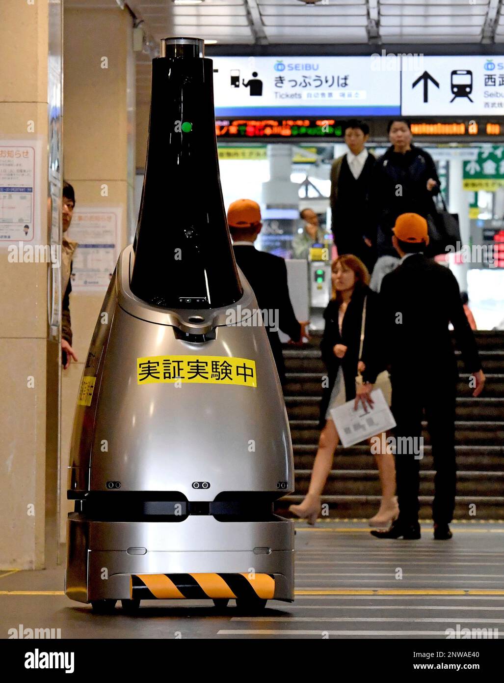 Perseusbot, a robot security guard, walks around the yard of Seibu Railway Shinjuku Station ...