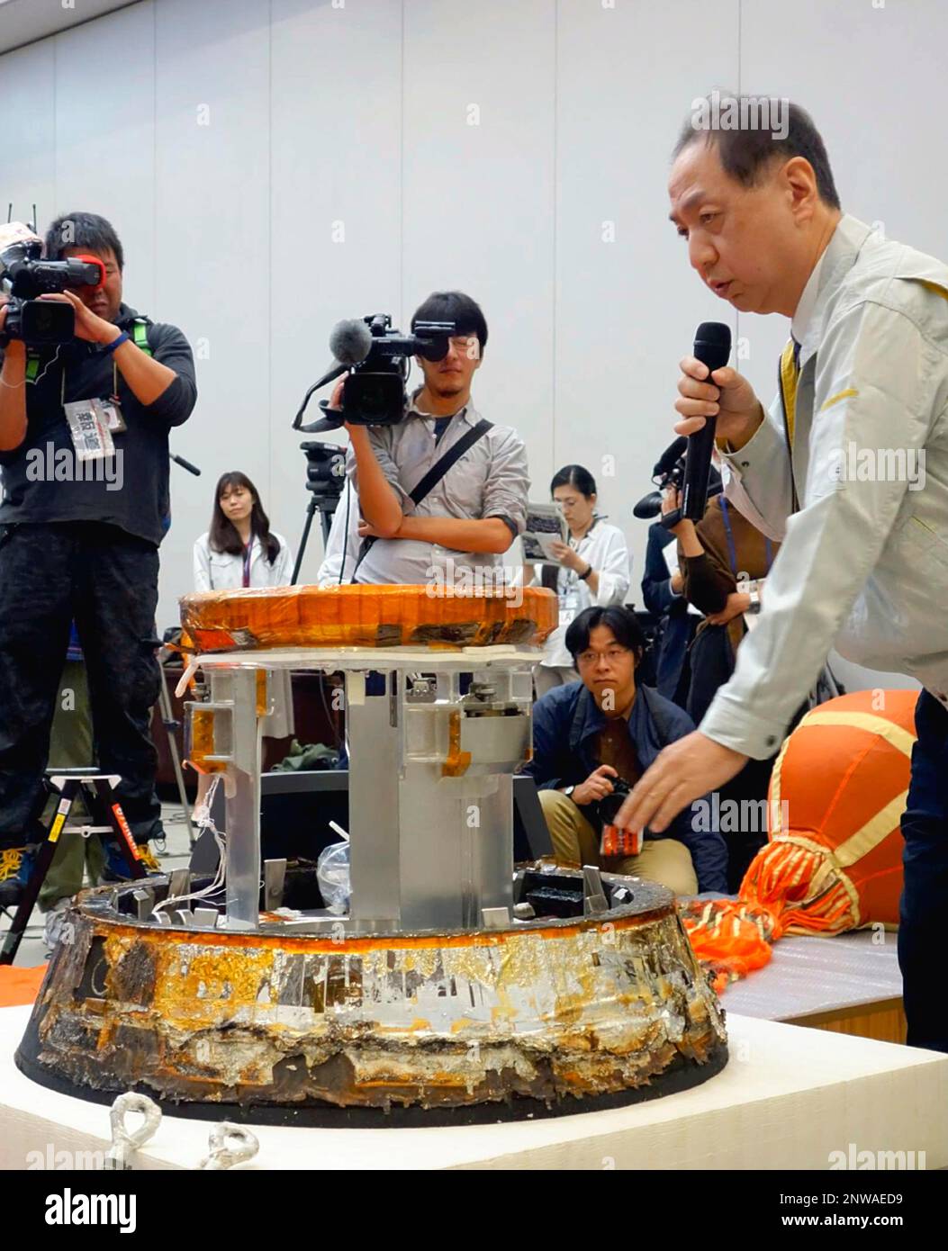 The Japan Aerospace Exploration Agency, or JAXA, unveils a compact ...