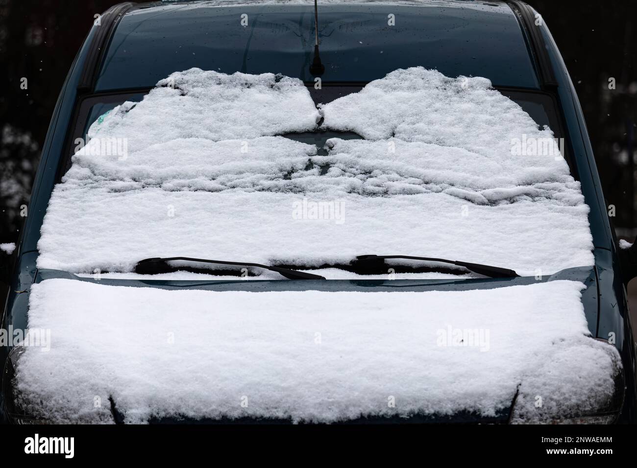 A car covered in a thick layer of snow with its windshield Stock Photo ...